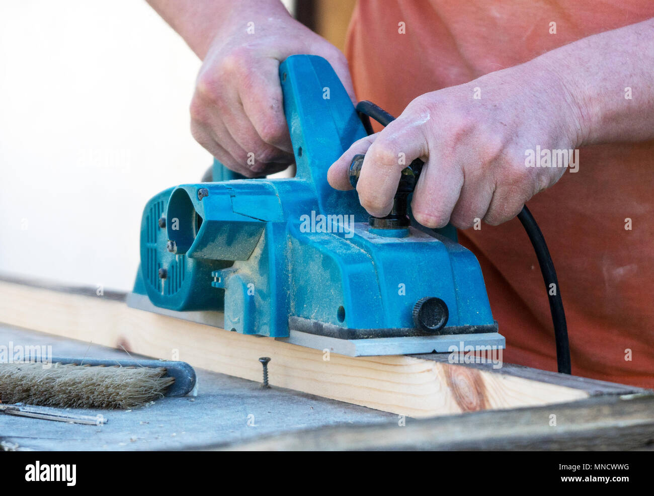 Handyman using polish machine outdoors Stock Photo - Alamy