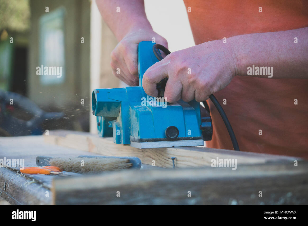 Handyman using polish machine outdoors Stock Photo - Alamy