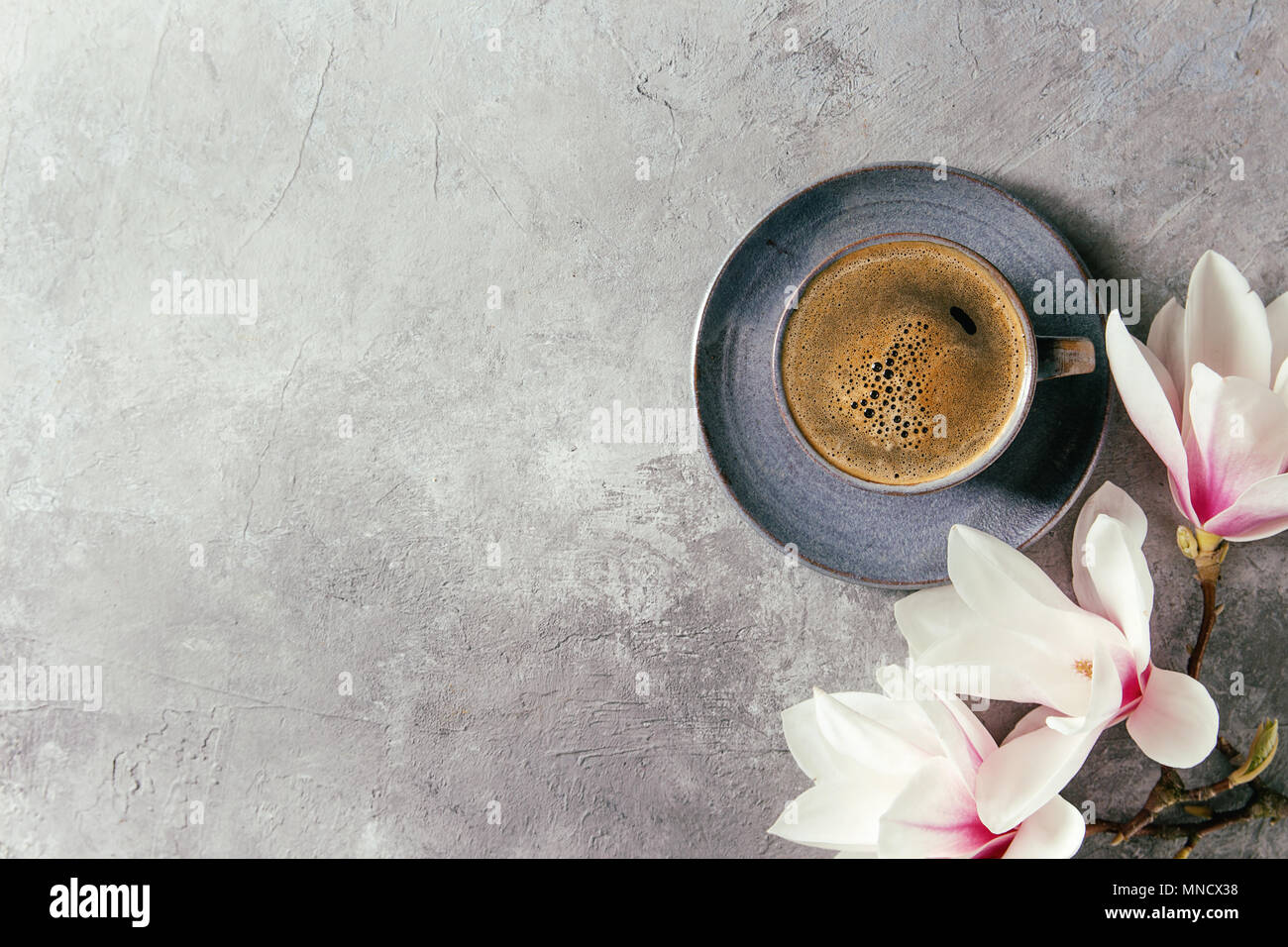 Coffee with spring flowers Stock Photo - Alamy