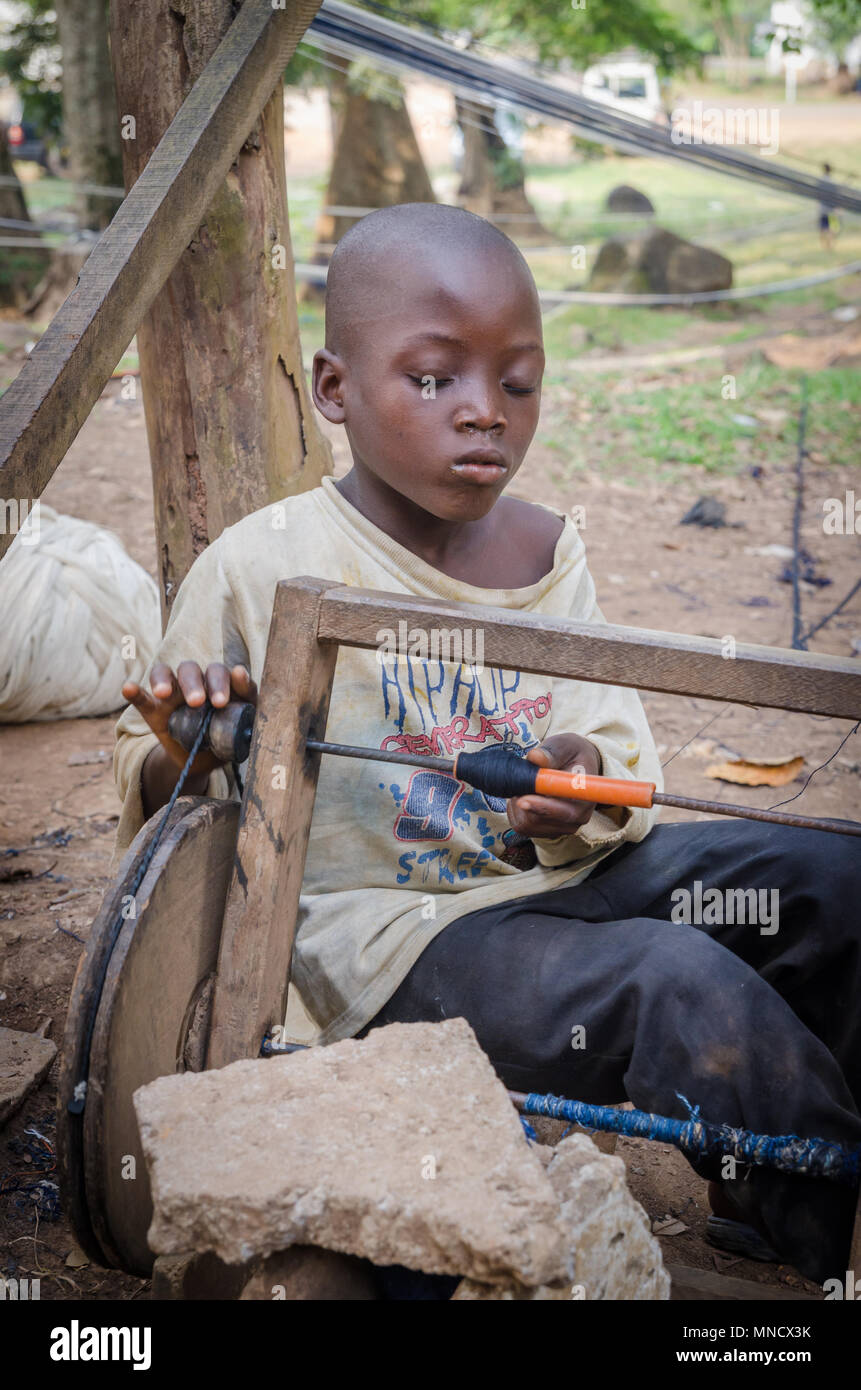 Man, Ivory Coast - January 31,2014: Unidentified African boy weaving ...