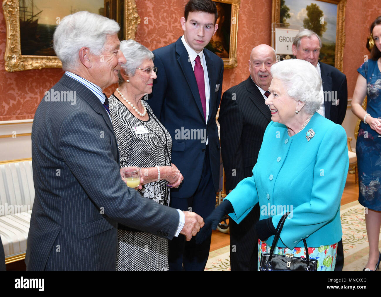 Queen Elizabeth II shakes hands with Jim Beaton GC at a reception for ...