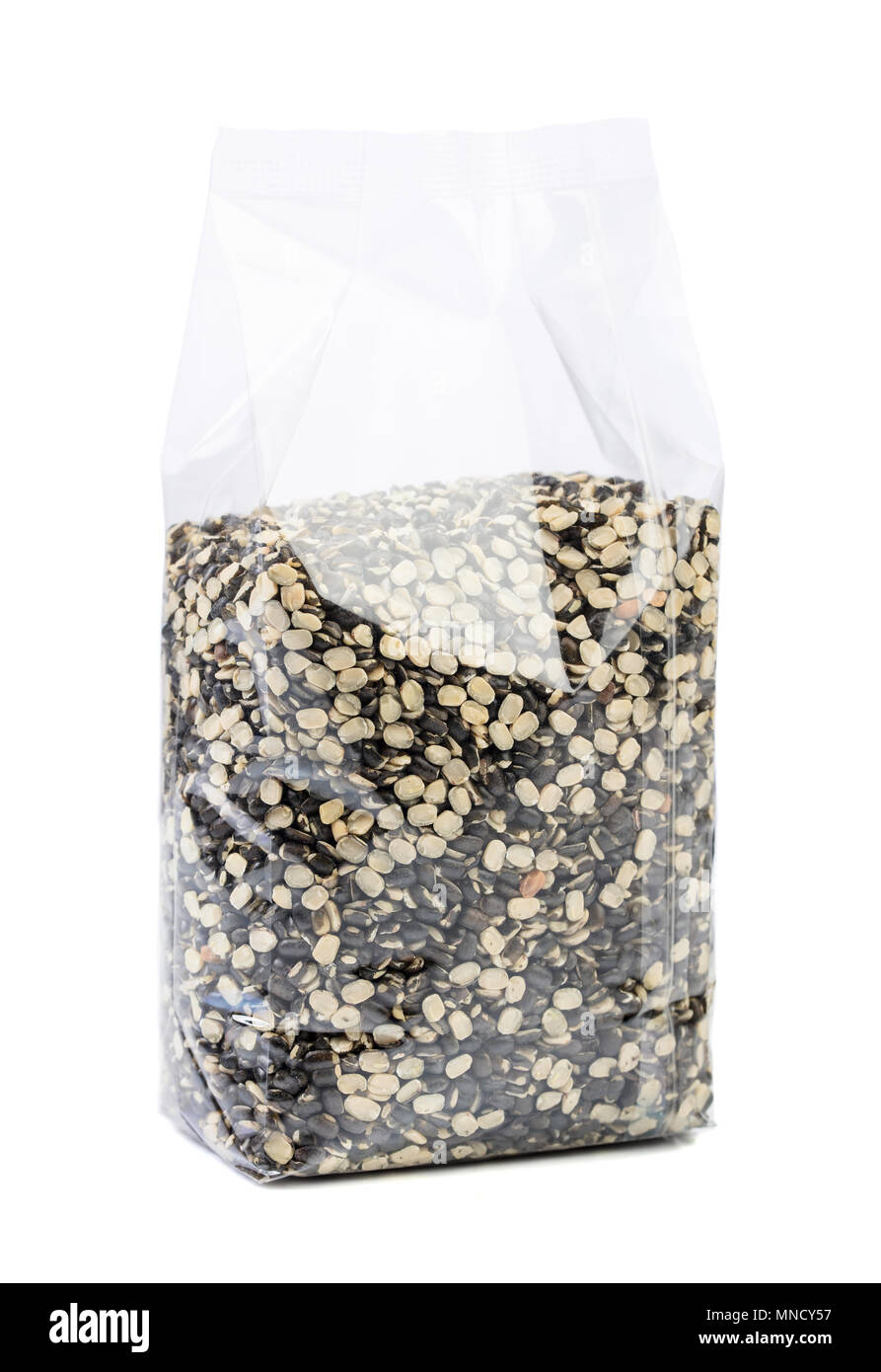 Mung beans or lentils in a transparent package isolated on a white ...