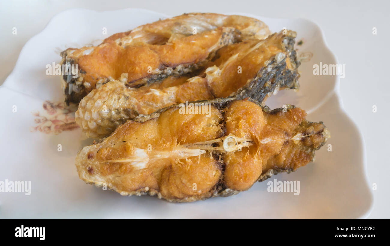 Crispy fish pieces, close up seafood dish Stock Photo - Alamy