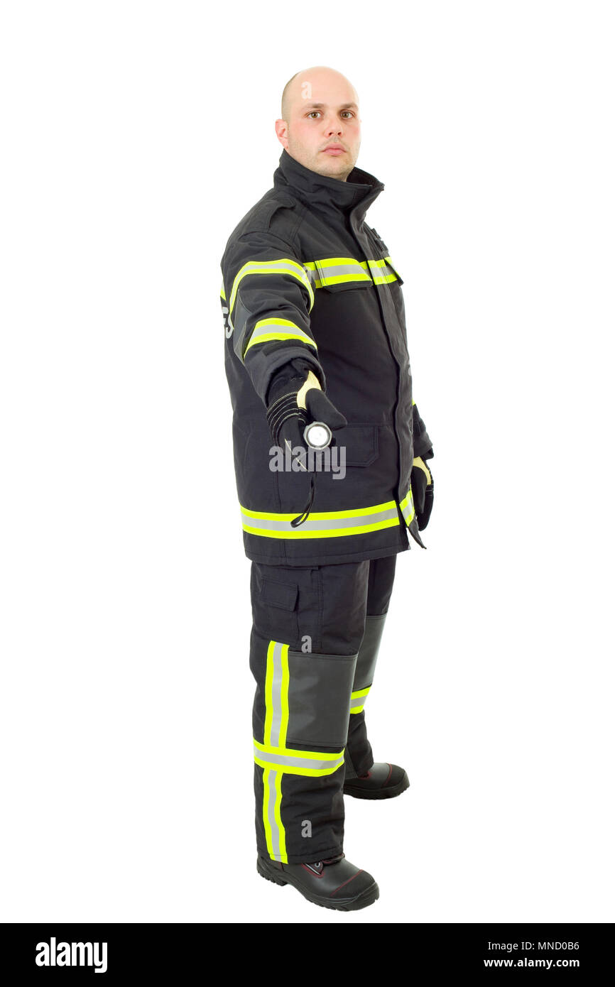 Serious firefighter with a flashlight. Full length studio shot isolated ...