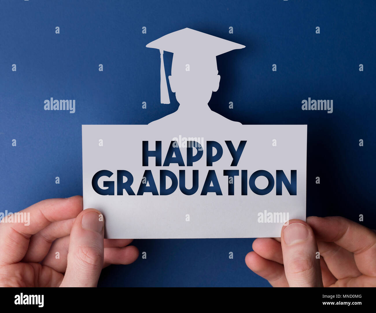 Graduation card. Male hands holding card with graduate cutout Stock ...