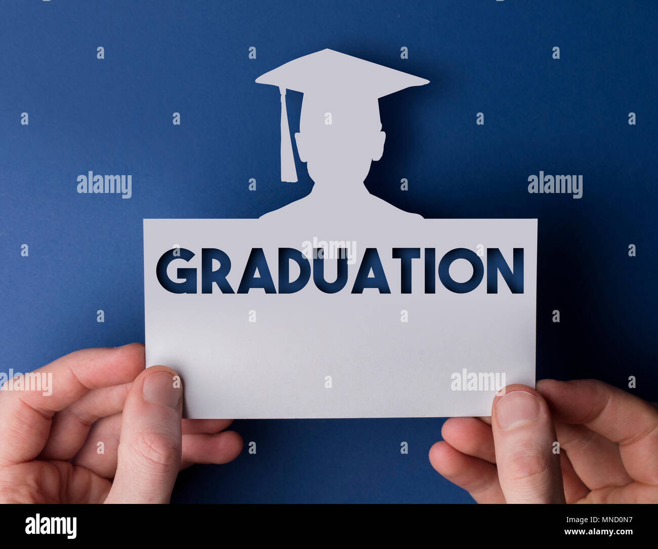 Graduation card. Male hands holding card with graduate cutout Stock ...