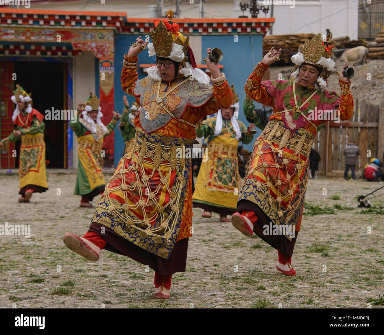 Tibetan monks dancing at the Jinganqumo purification festival in Dege ...