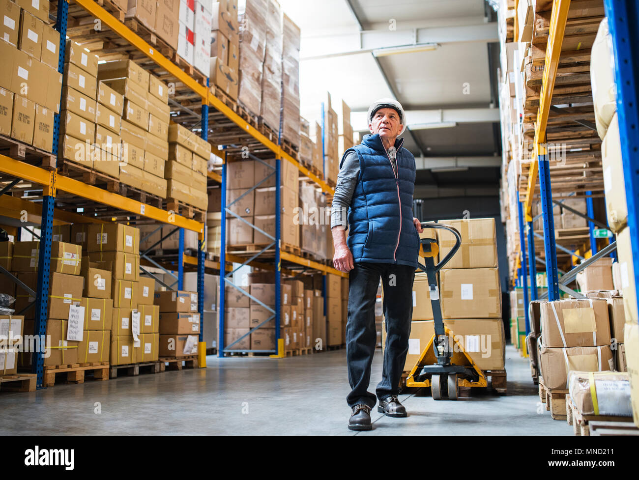 Warehouse pulling pallet truck boxes hi-res stock photography and ...
