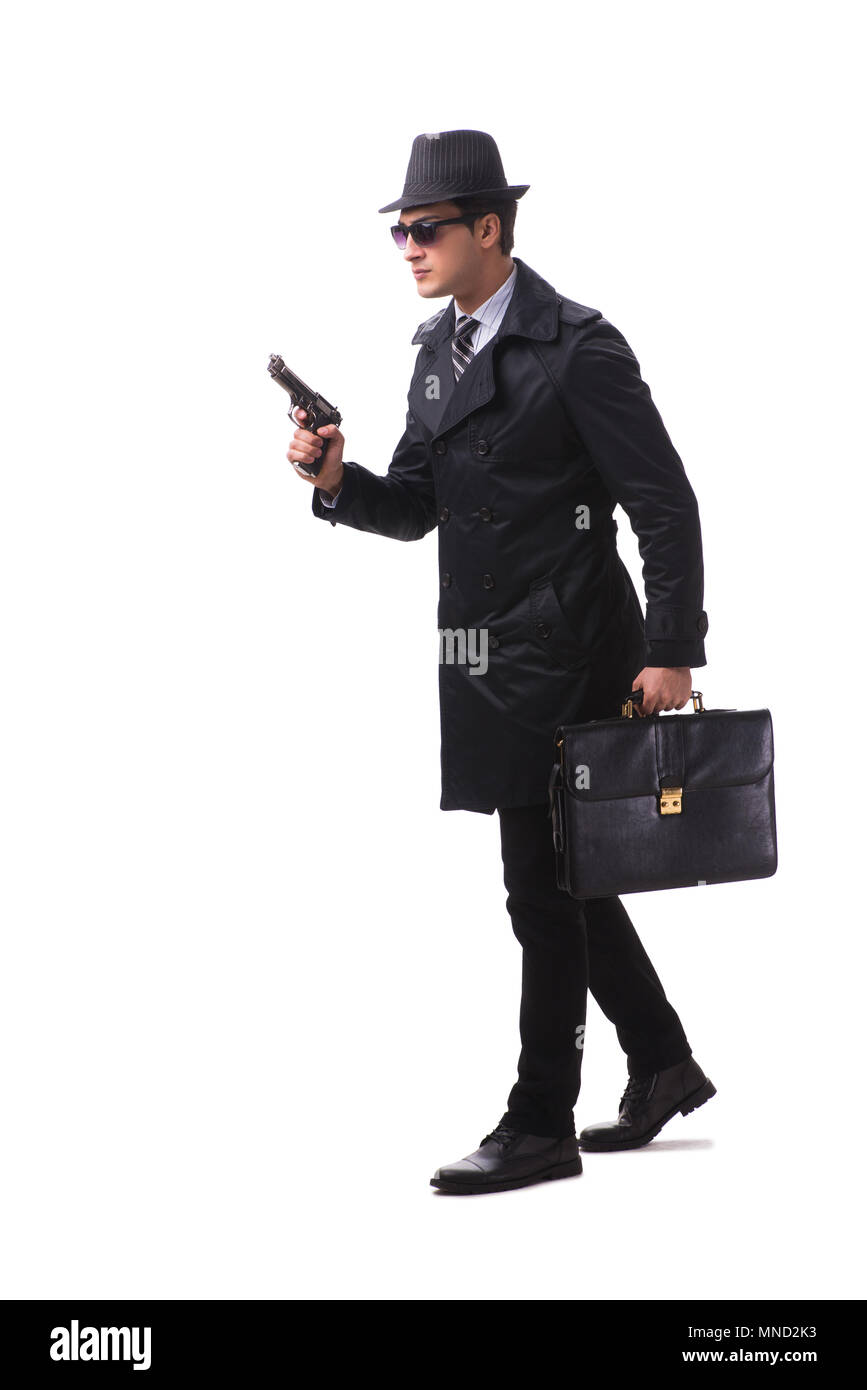 Man spy with handgun isolated on white background Stock Photo - Alamy