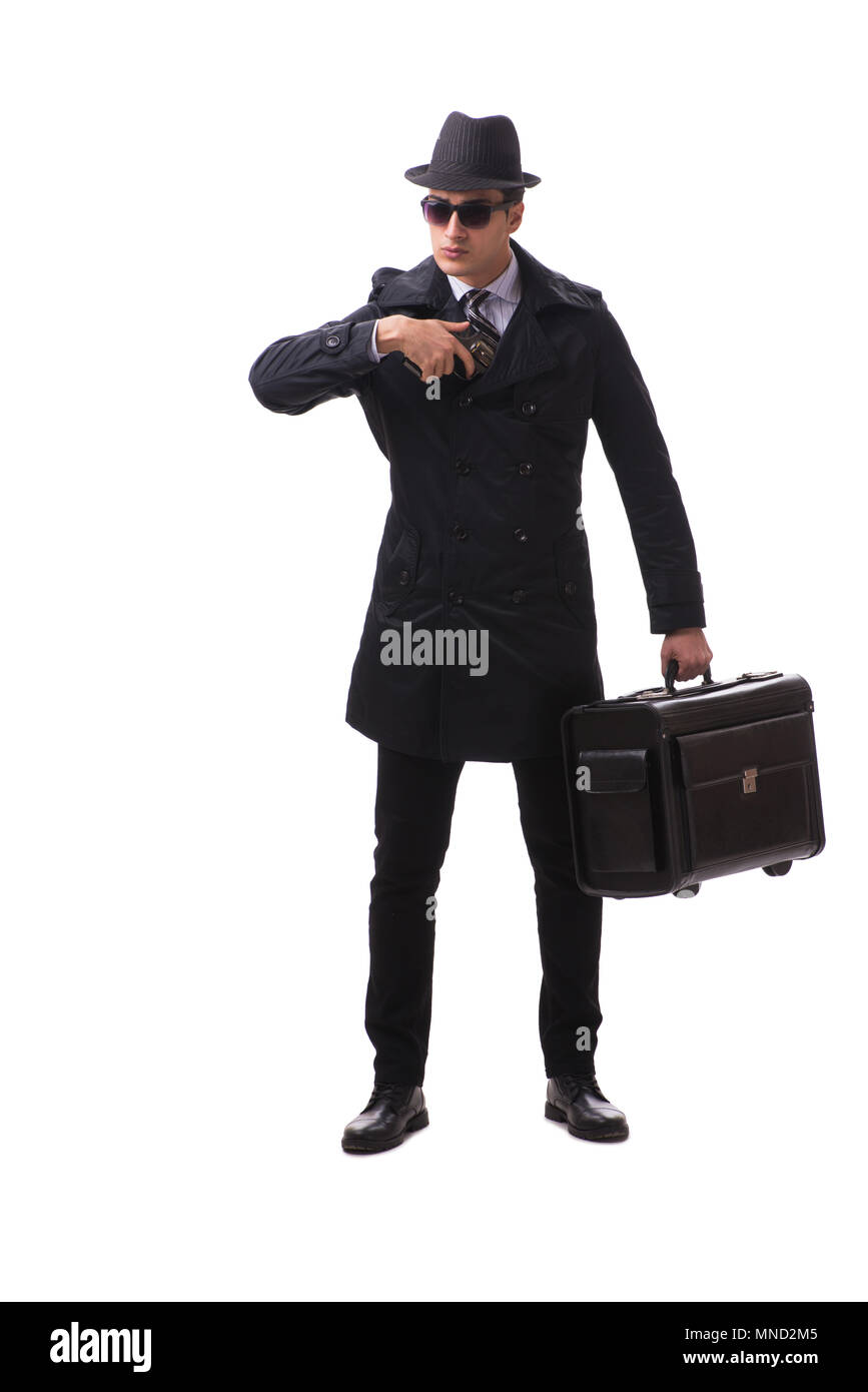 Man spy with handgun isolated on white background Stock Photo - Alamy