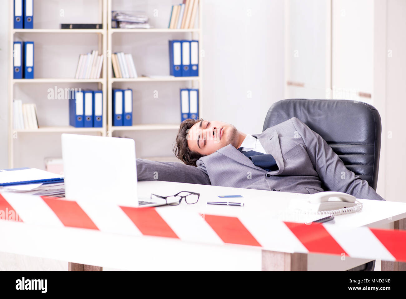 Dead businessman at this desk Stock Photo - Alamy