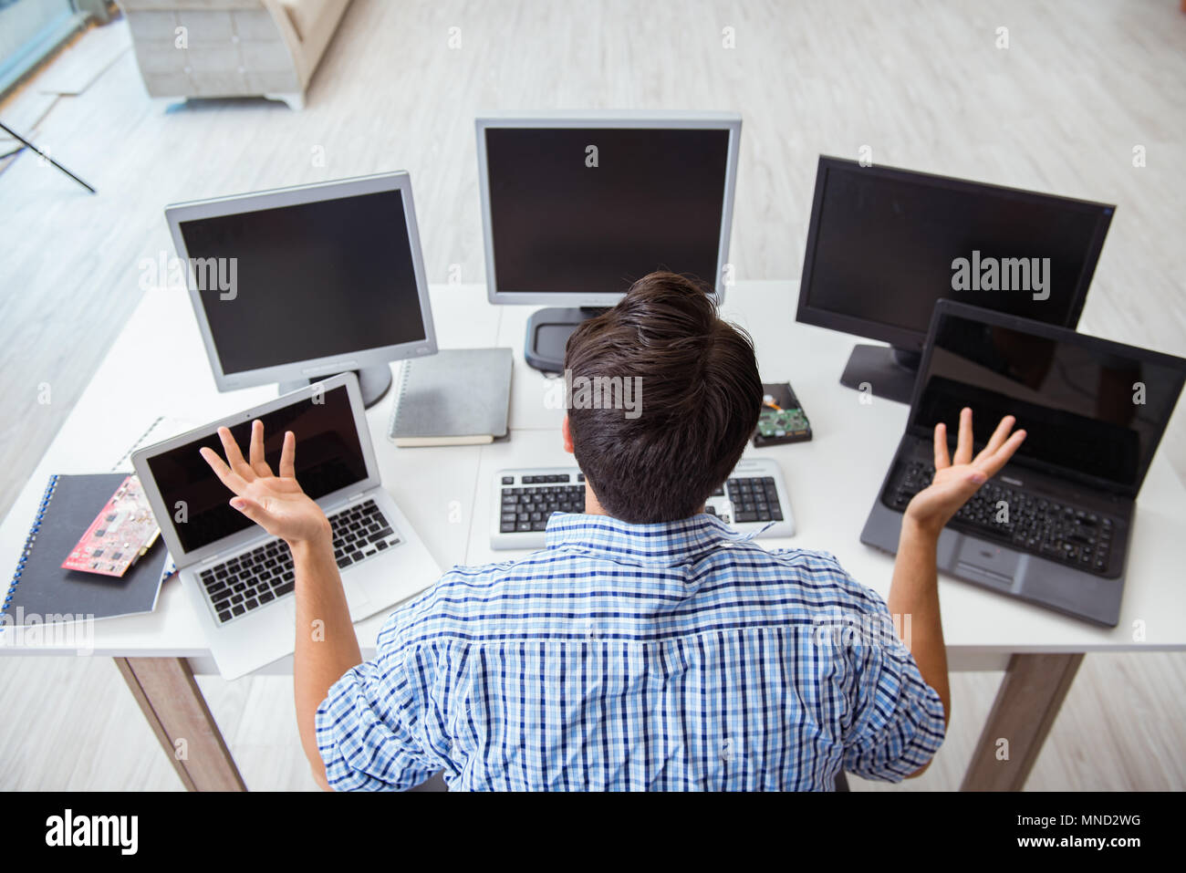 Man in front of many screens hi-res stock photography and images - Alamy