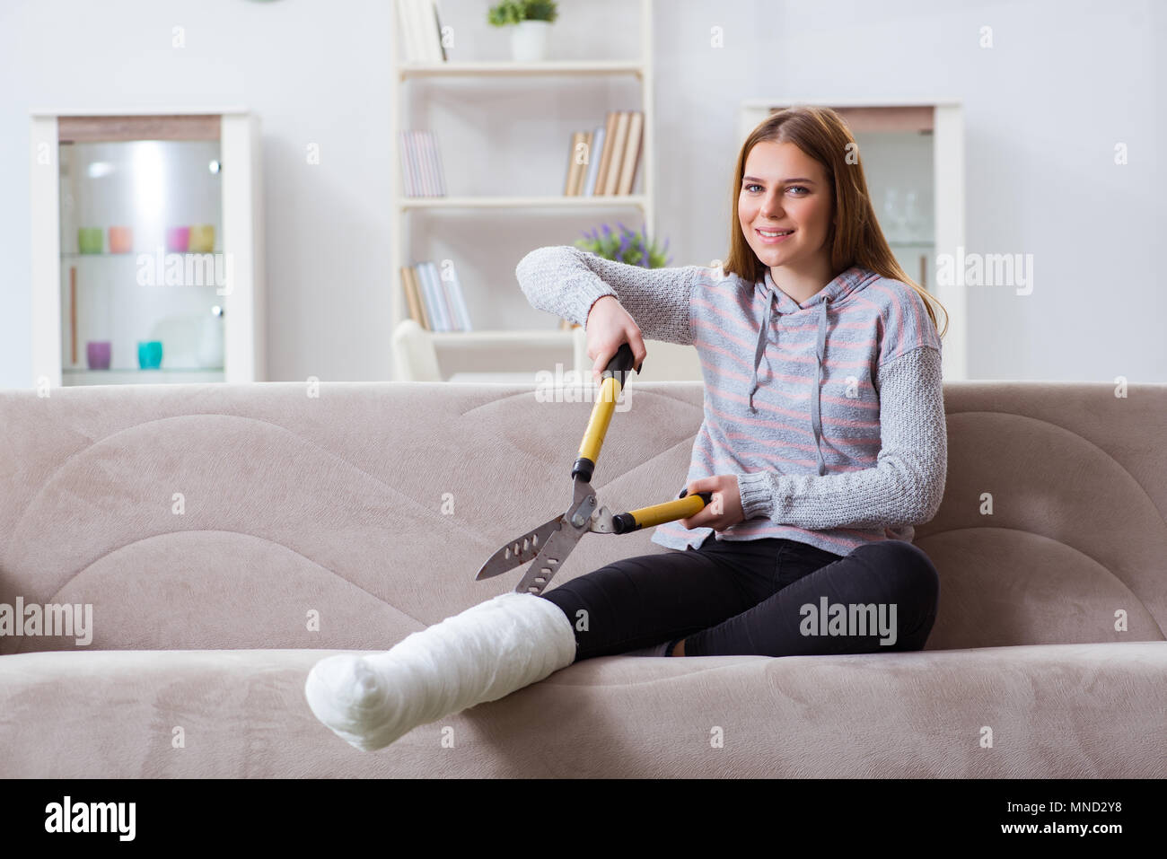 Young woman with broken leg at home Stock Photo - Alamy