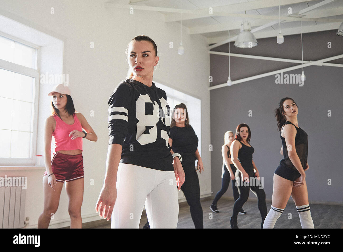 Confident female friends dancing while practicing in dance studio Stock ...