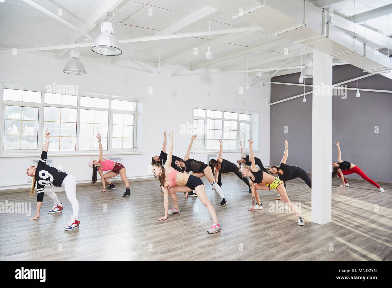 Full length of performers practicing in dance studio Stock Photo - Alamy