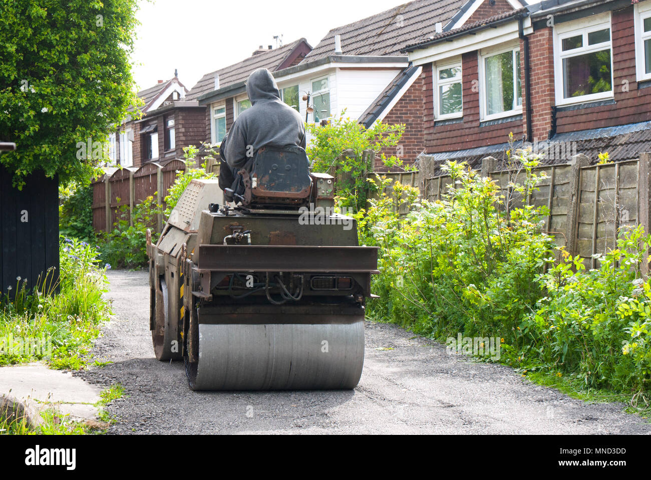 Road roller flattening asphalt on a small track,England, UK Stock Photo ...