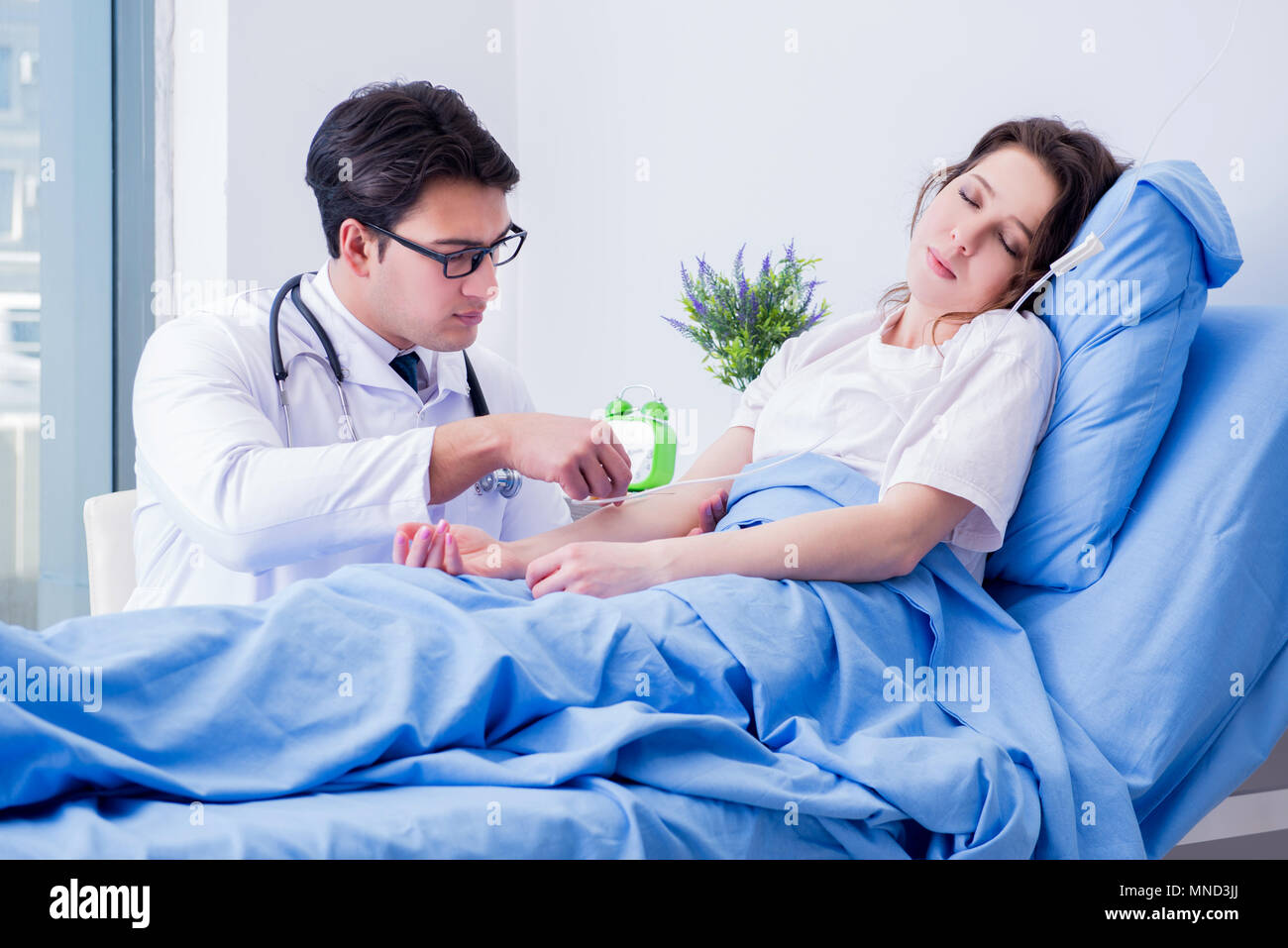 Doctor doing medical injection in hospital room Stock Photo - Alamy