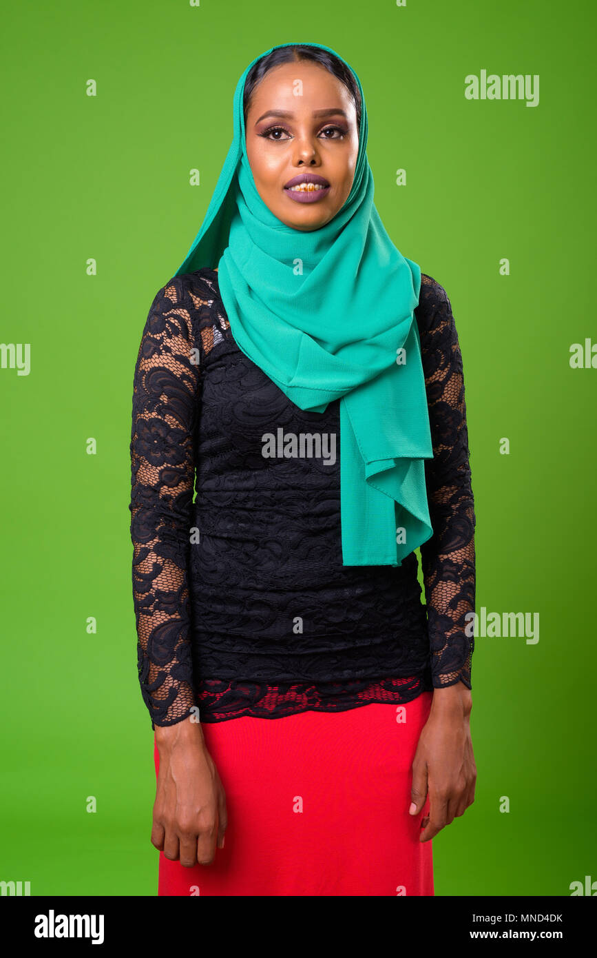 Young African Muslim woman against chroma key with green background ...