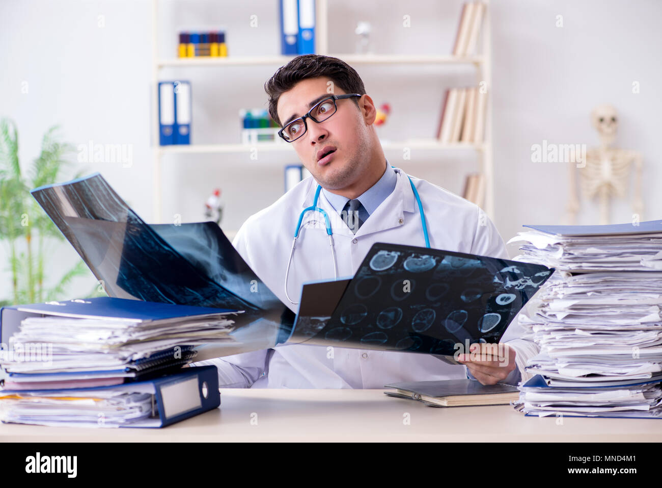 Tired radiologist with x-ray image in hospital Stock Photo - Alamy