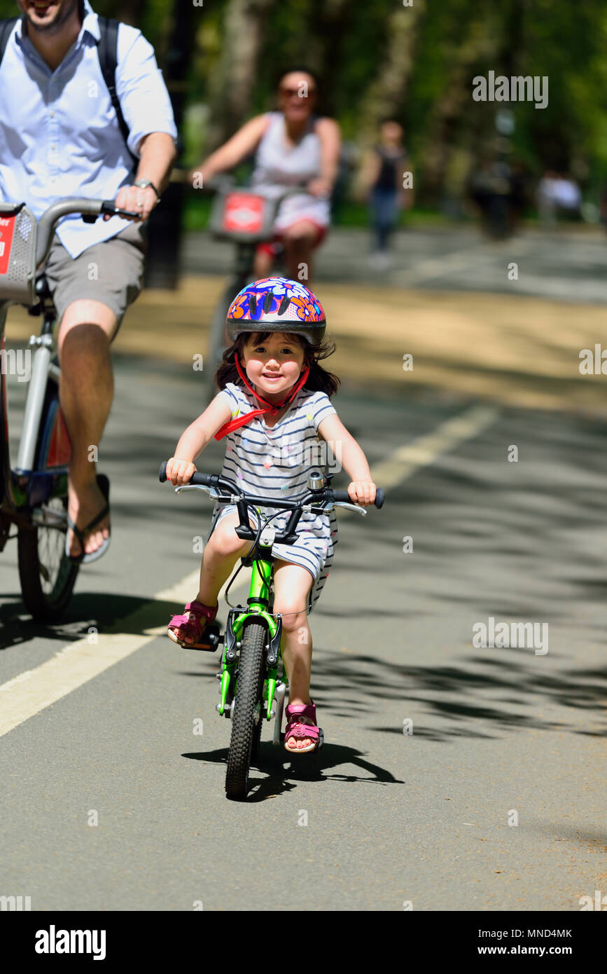 Young girl cycling, Hyde Park, London, United Kingdom Stock Photo - Alamy