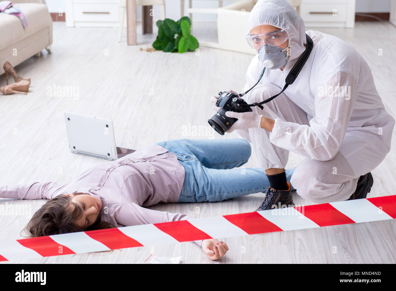 Forensic investigator at the crime scene investigating woman murder ...