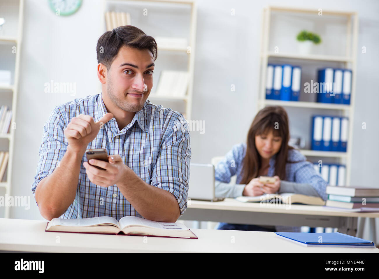 Students sitting and studying in classroom college Stock Photo - Alamy