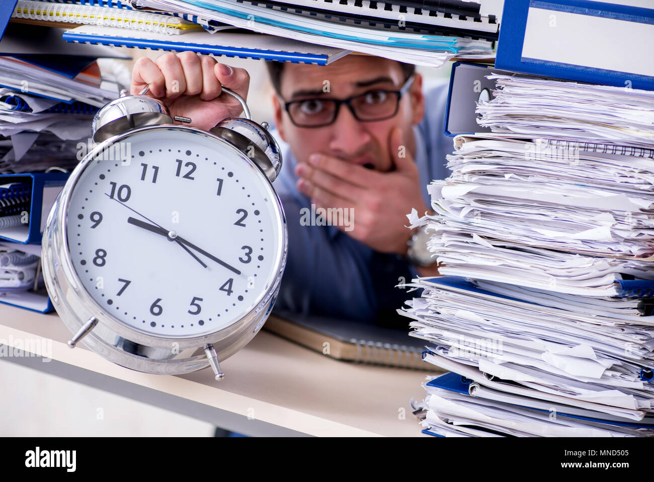 Extremely busy businessman working in office Stock Photo - Alamy