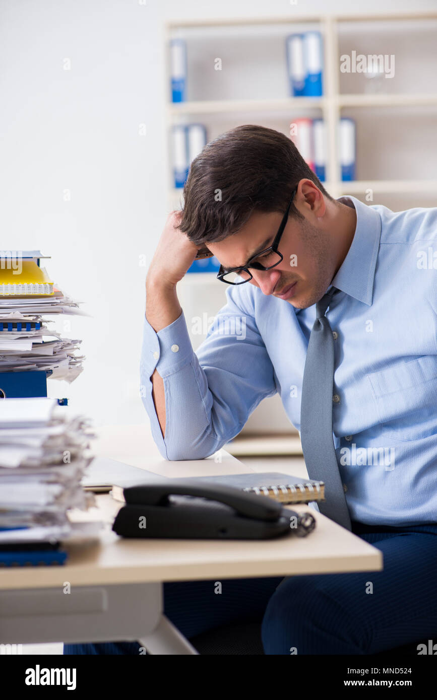 Extremely busy businessman working in office Stock Photo - Alamy