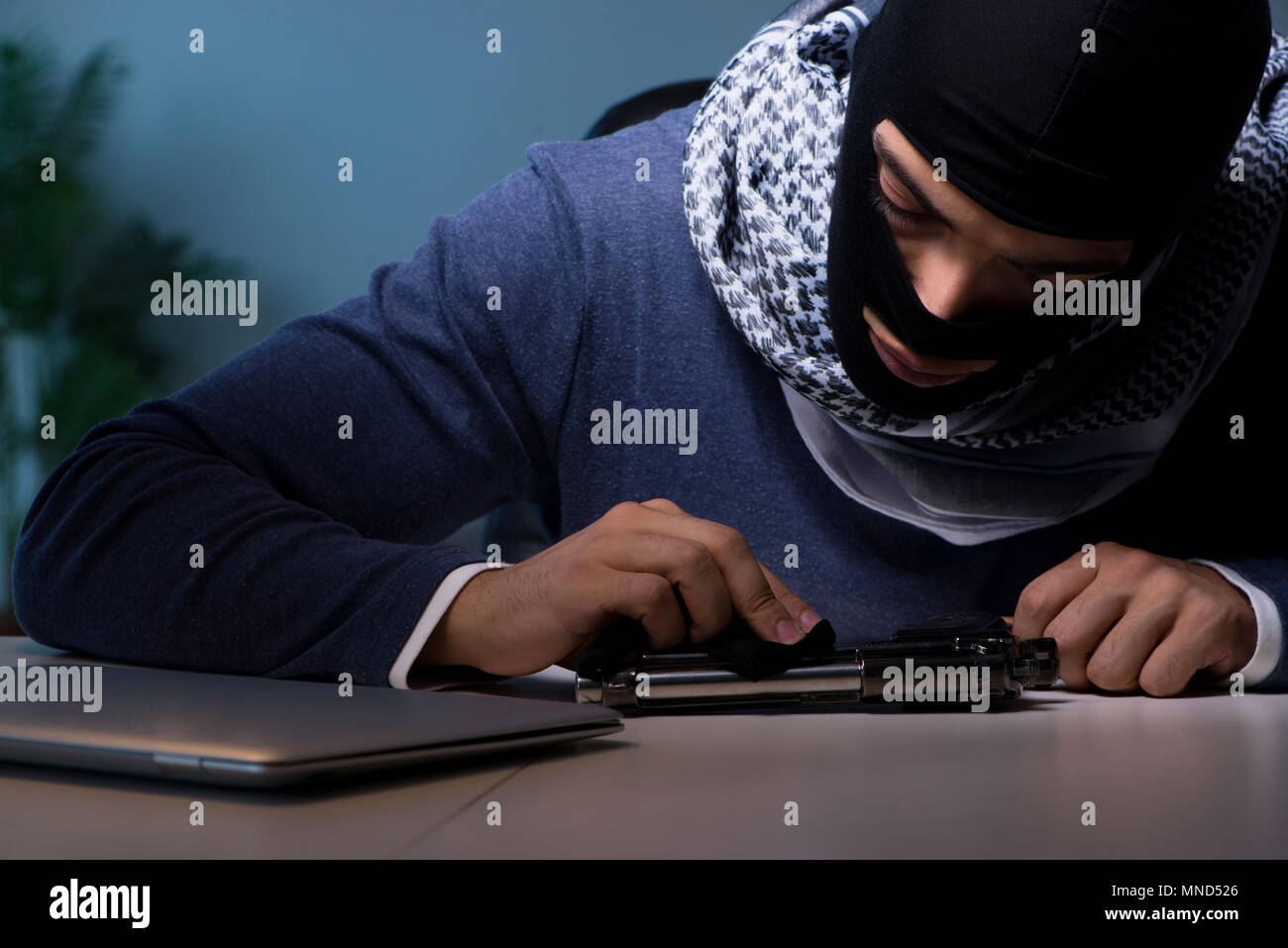 Terrorist burglar with gun asking for money ransom Stock Photo - Alamy