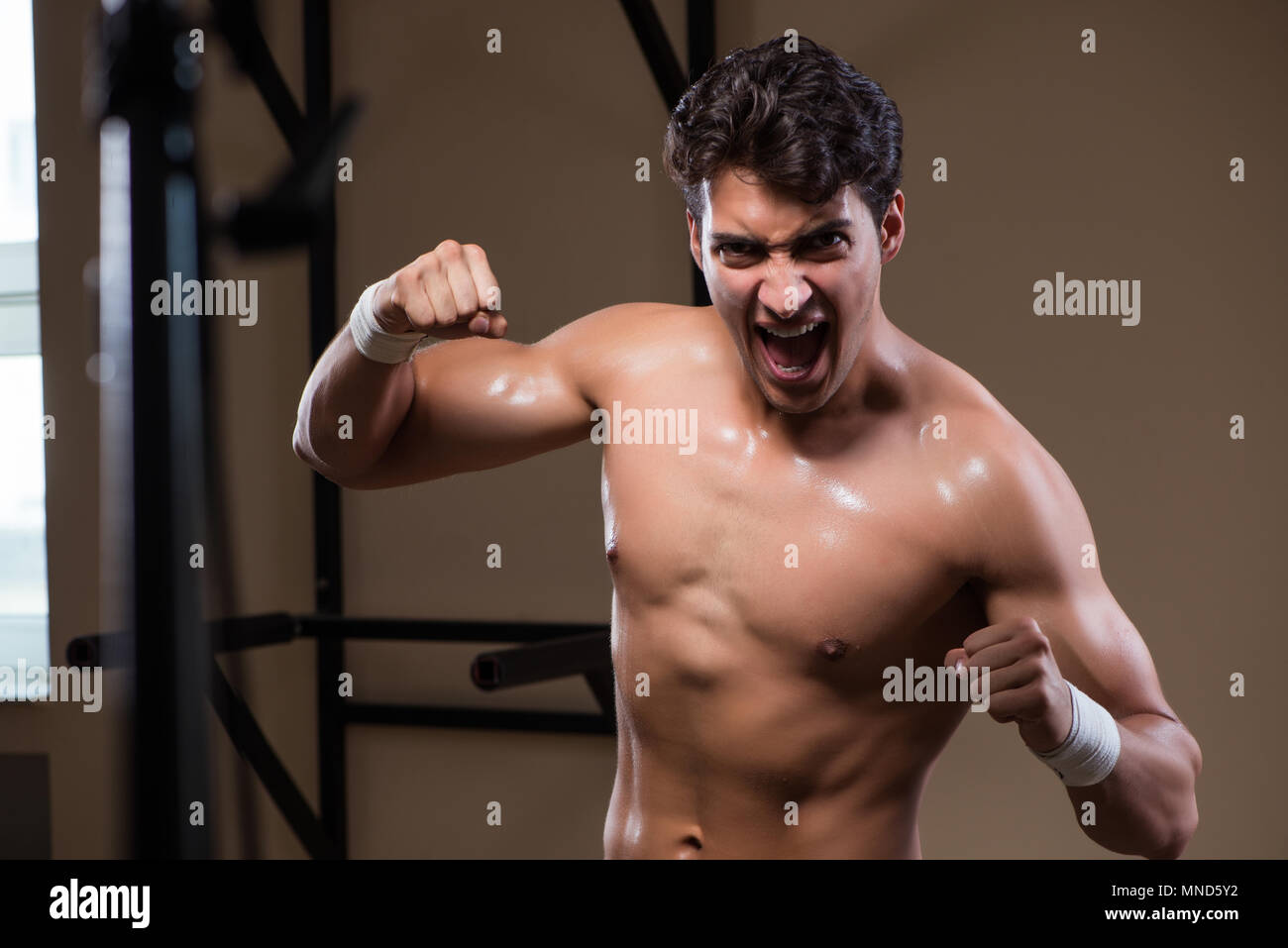 Ripped muscular man in gym doing sports Stock Photo - Alamy