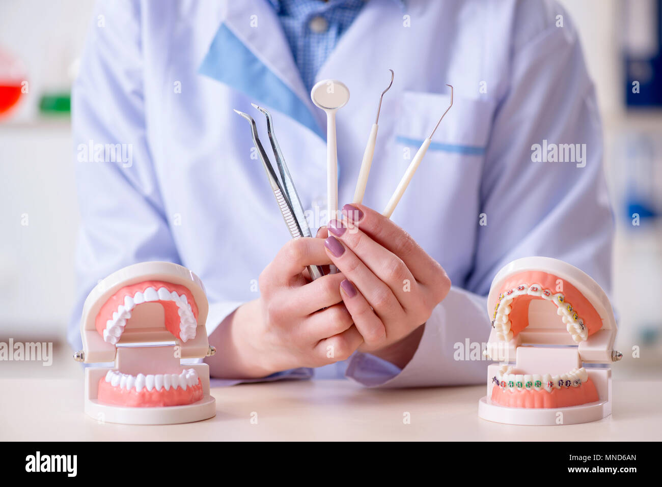 Dentist practicing work on tooth model Stock Photo - Alamy