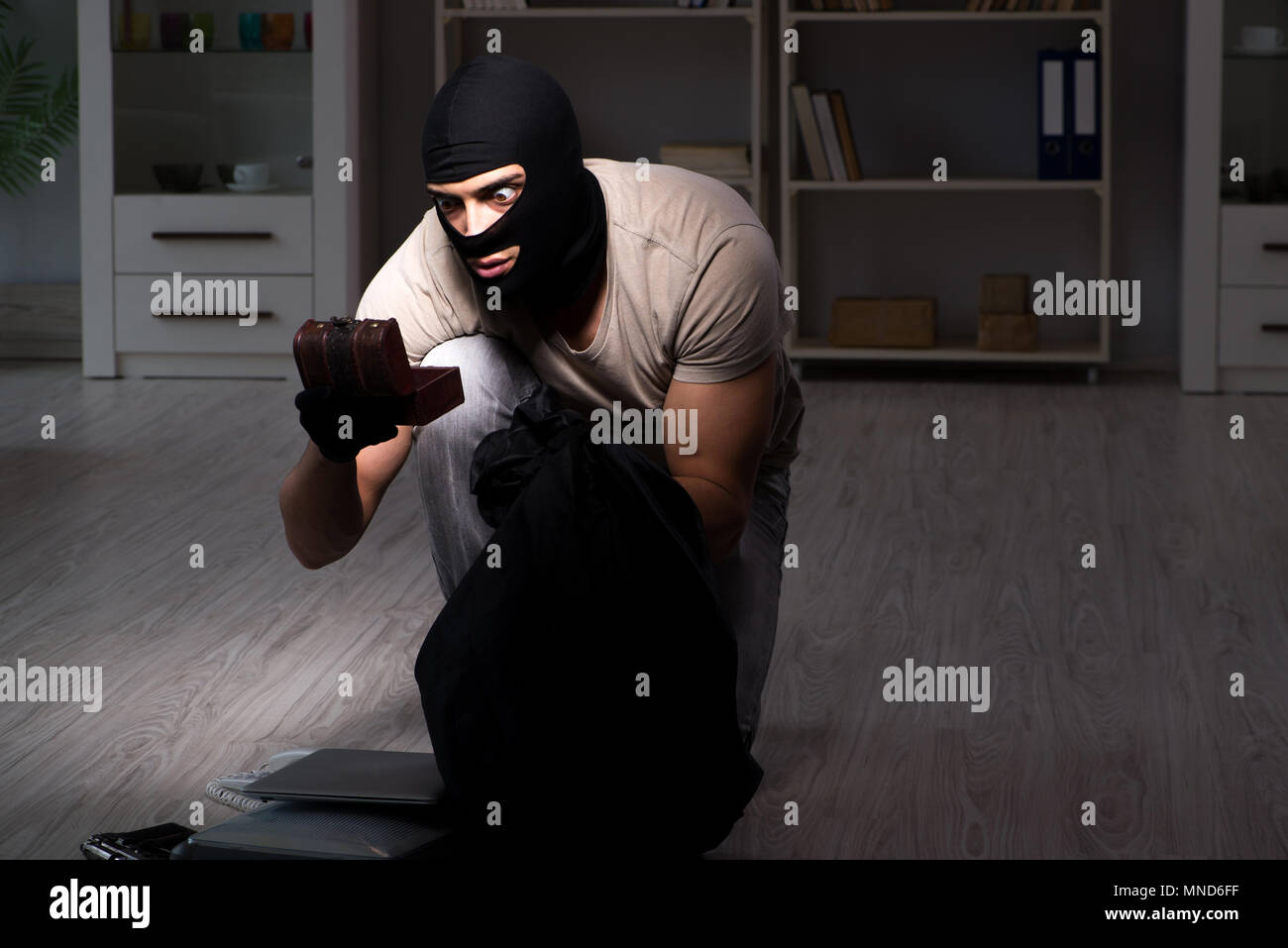 Burglar wearing balaclava mask at crime scene Stock Photo - Alamy