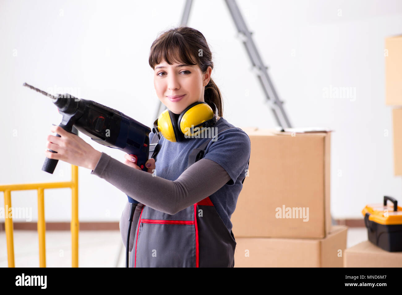 Woman noise drill hi-res stock photography and images - Alamy