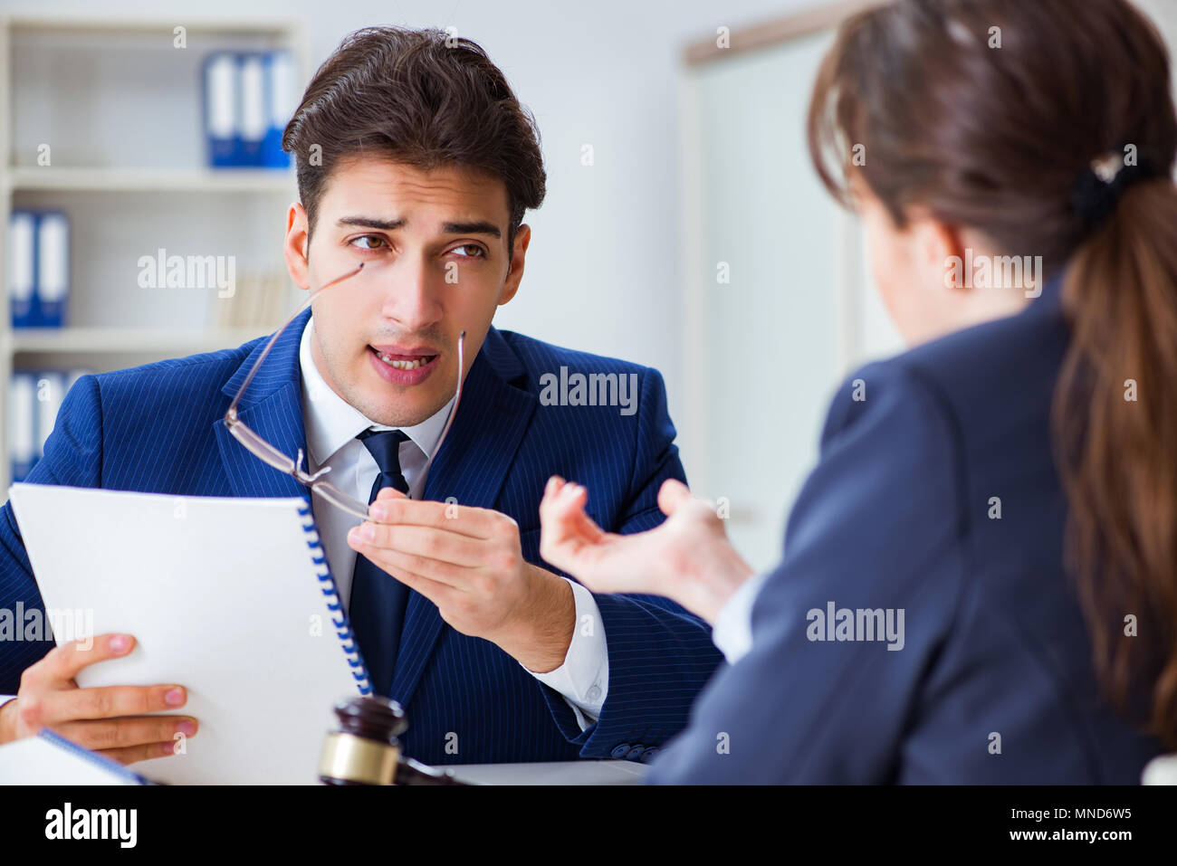 Lawyer talking to his client in office Stock Photo - Alamy