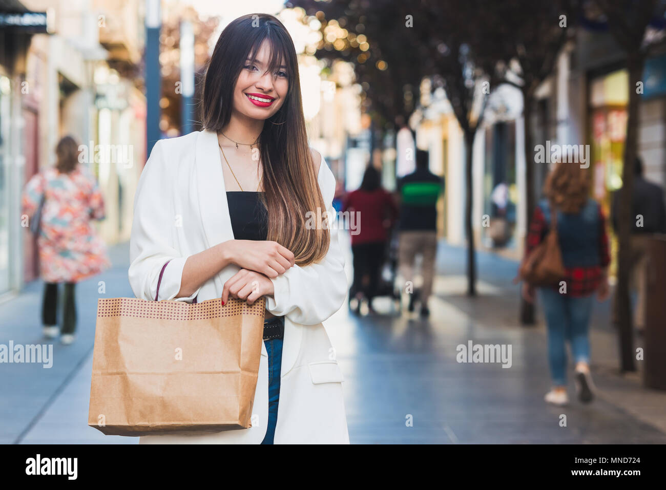 happy woman buying in comercial street Stock Photo - Alamy