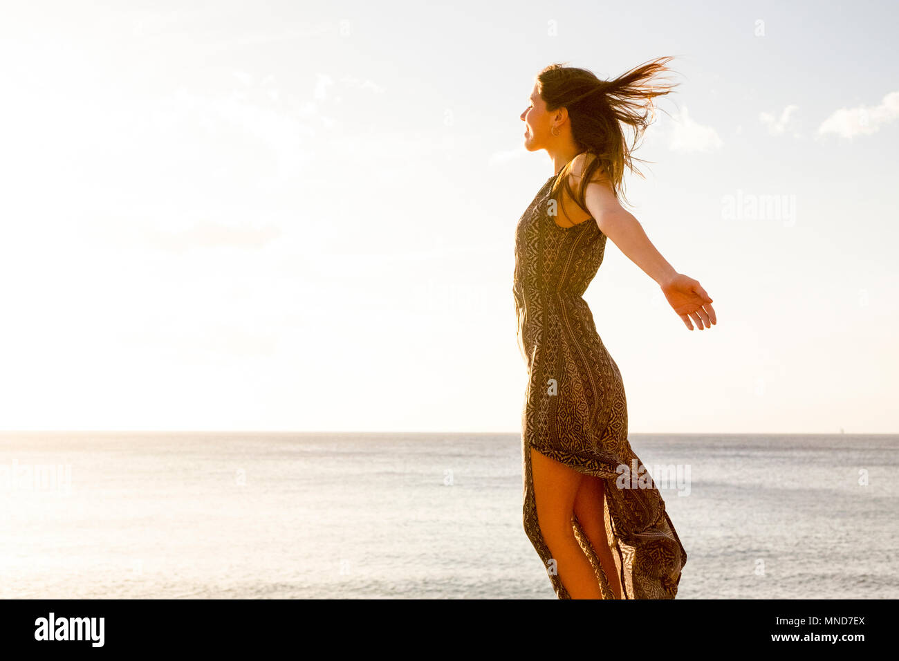 Young nice woman enjoy her freedom opening arms. Independent life and ...