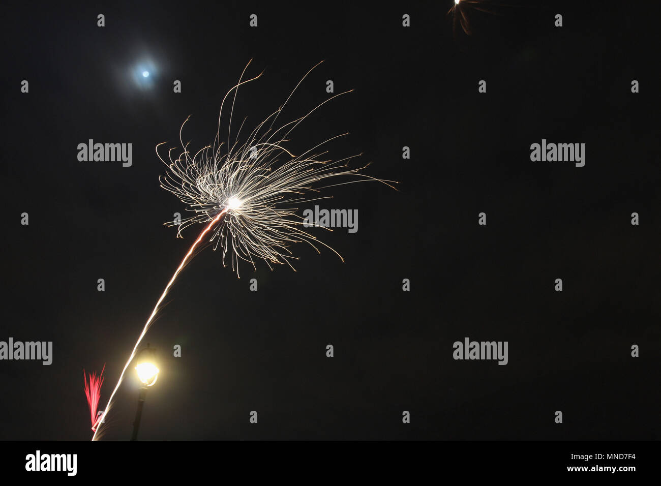 Low angle view of firework exploding in sky at night Stock Photo - Alamy