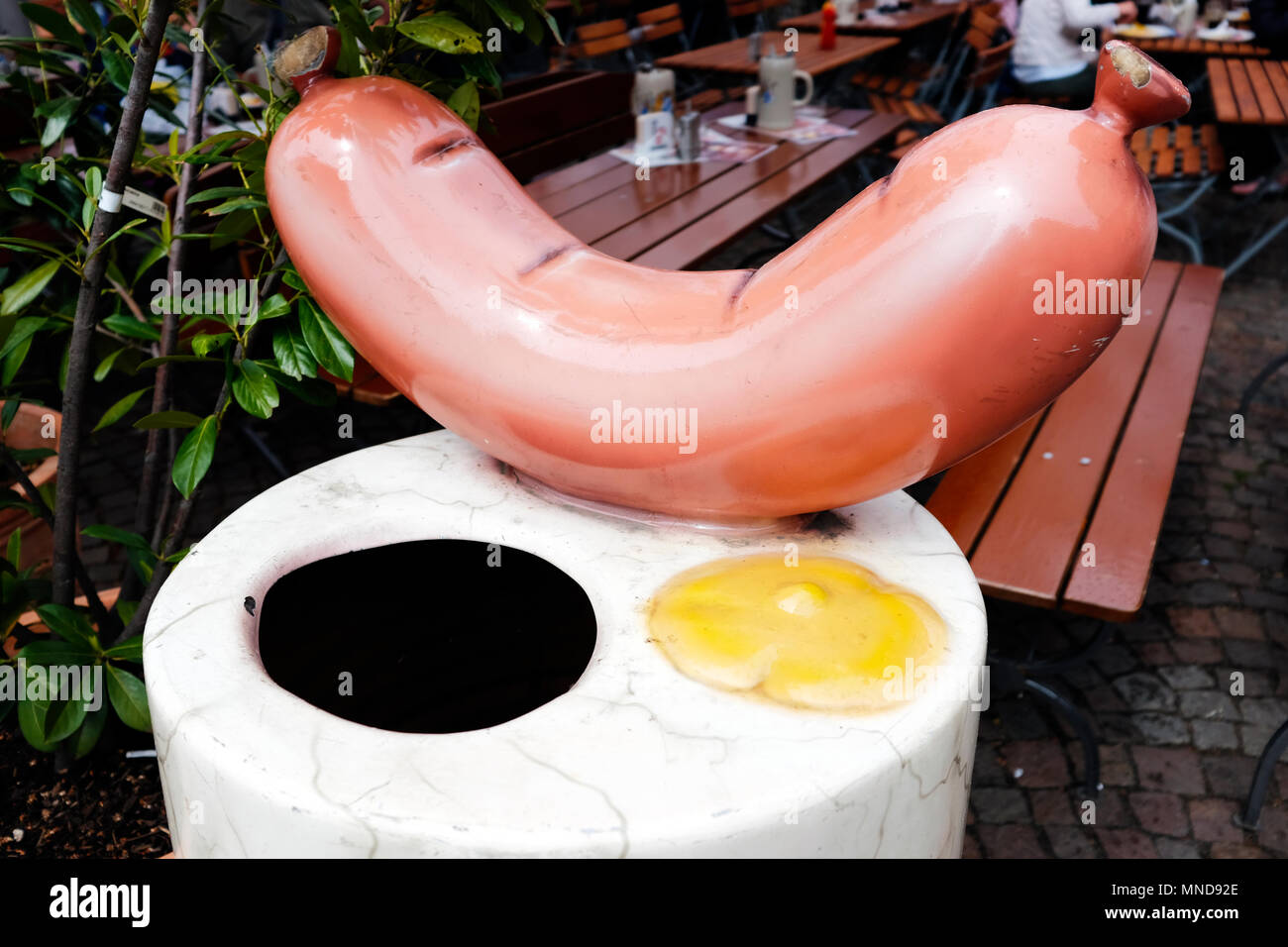 Sausage-shaped garbage bin Stock Photo - Alamy