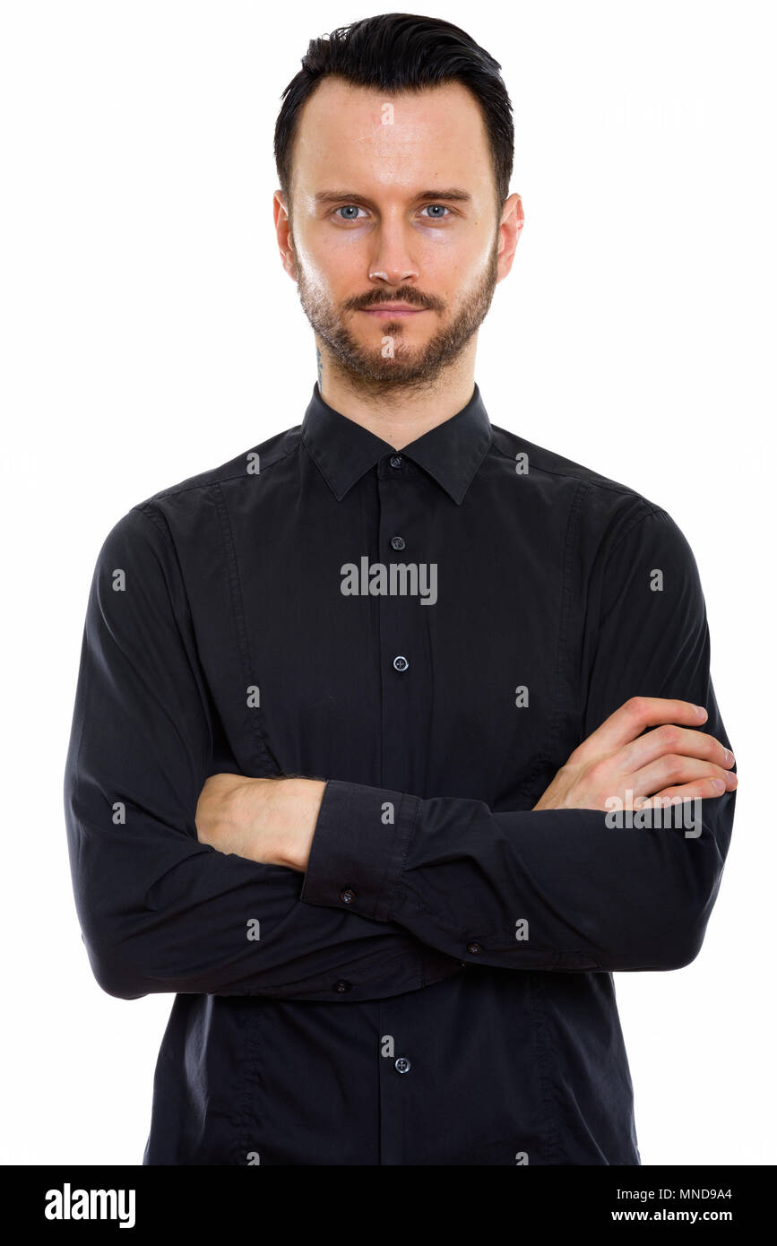 Studio shot of young man with arms crossed Stock Photo - Alamy