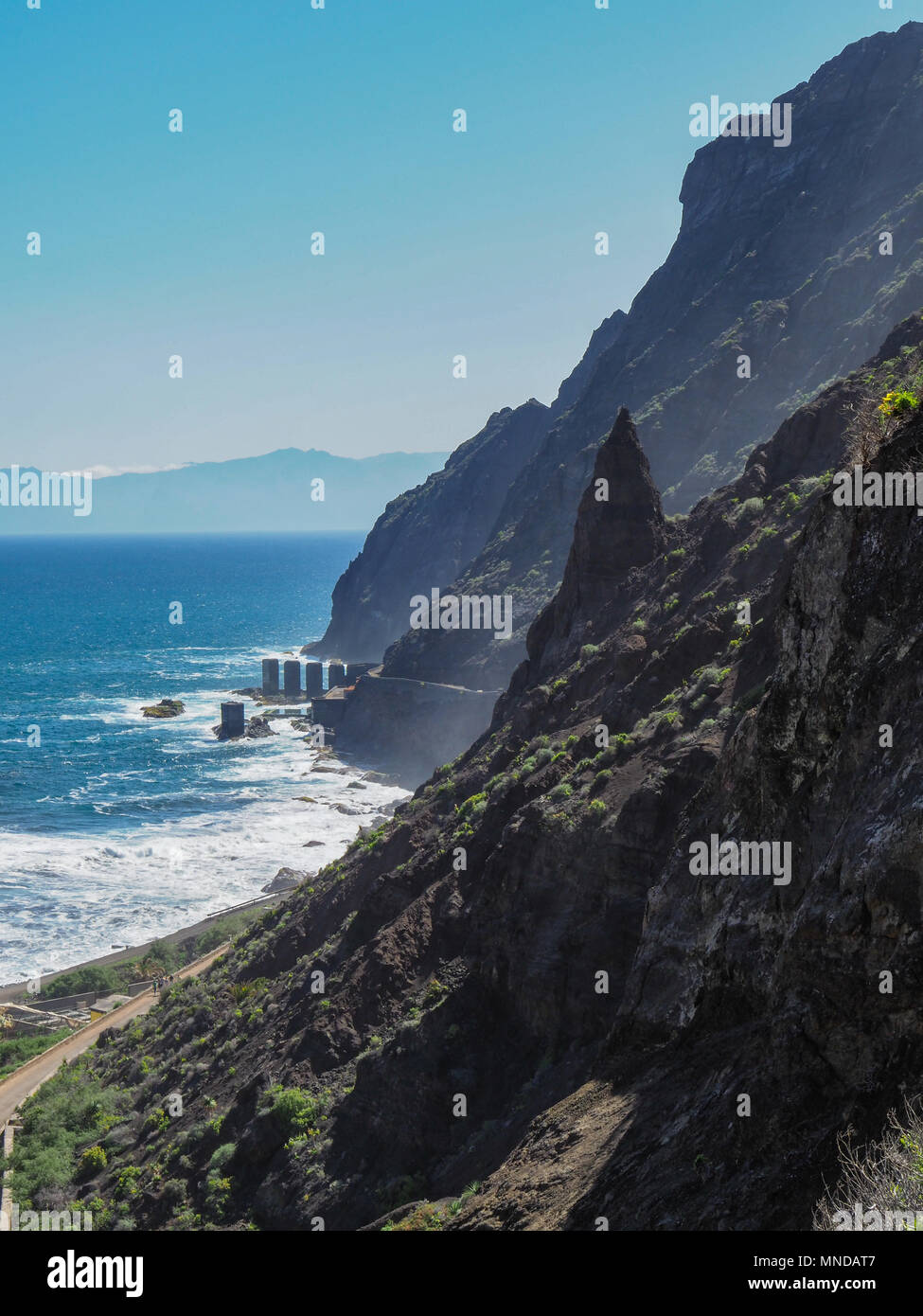 Punta Gabina at Hermigua in La Gomera in the Canary Islands with piers of the derelict jetty ...