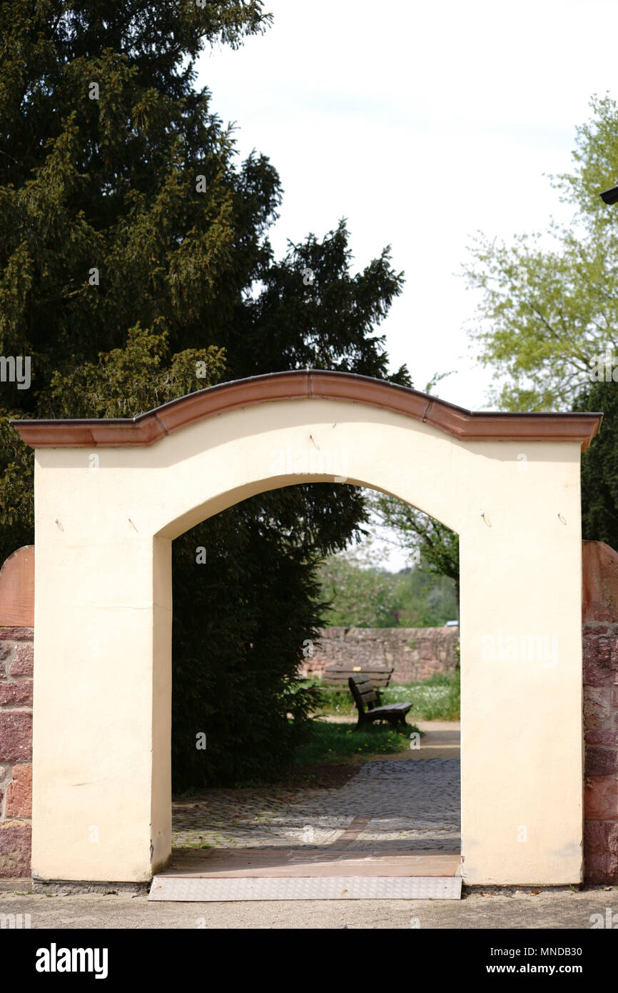 An open passage or entrance gate with round arch to a cemetery Stock ...