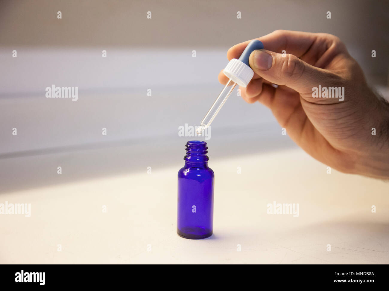 Water dropper and hand hi-res stock photography and images - Alamy