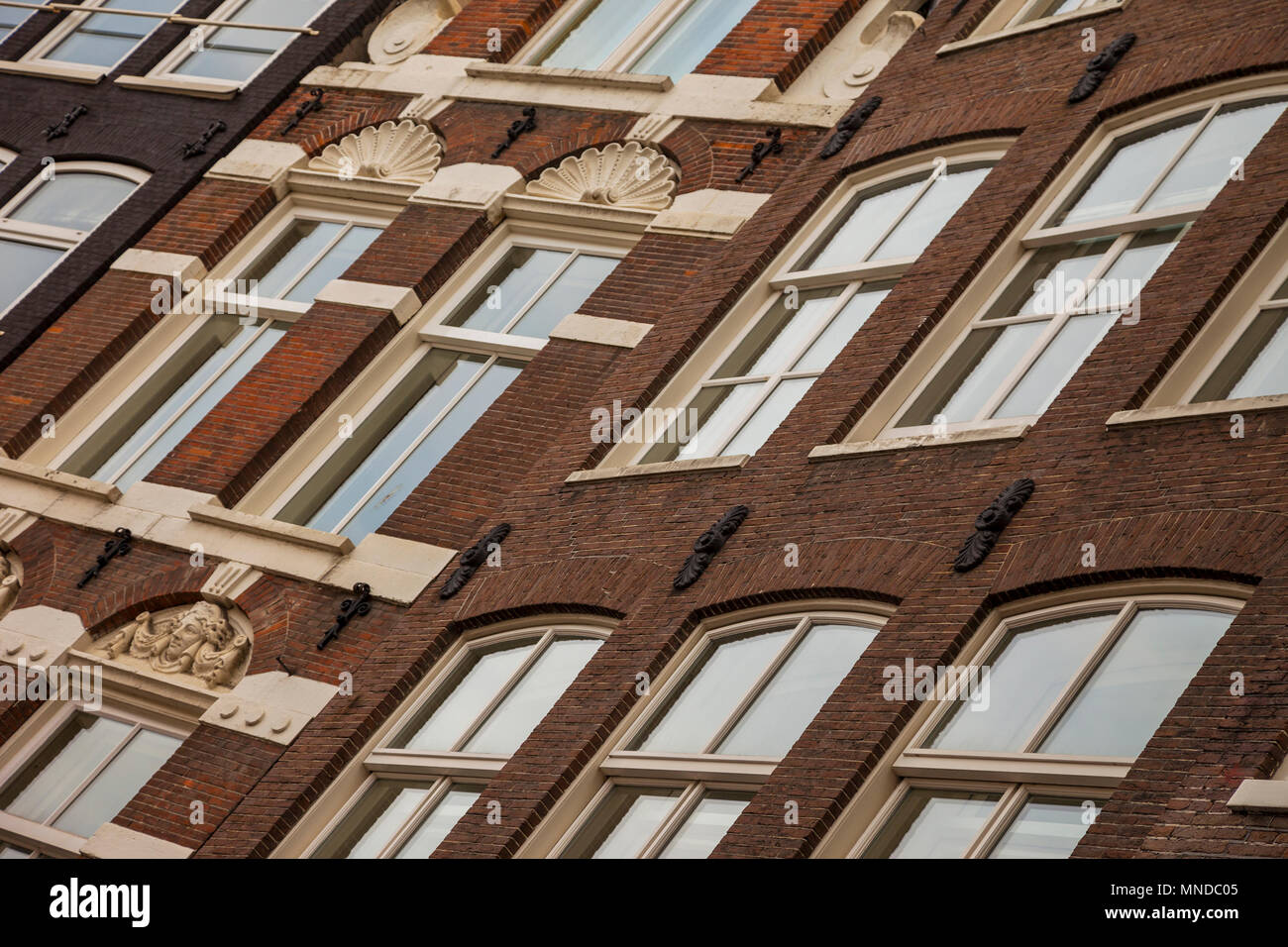 Typical architecture of dutch buildings front in Amsterdam Stock Photo ...