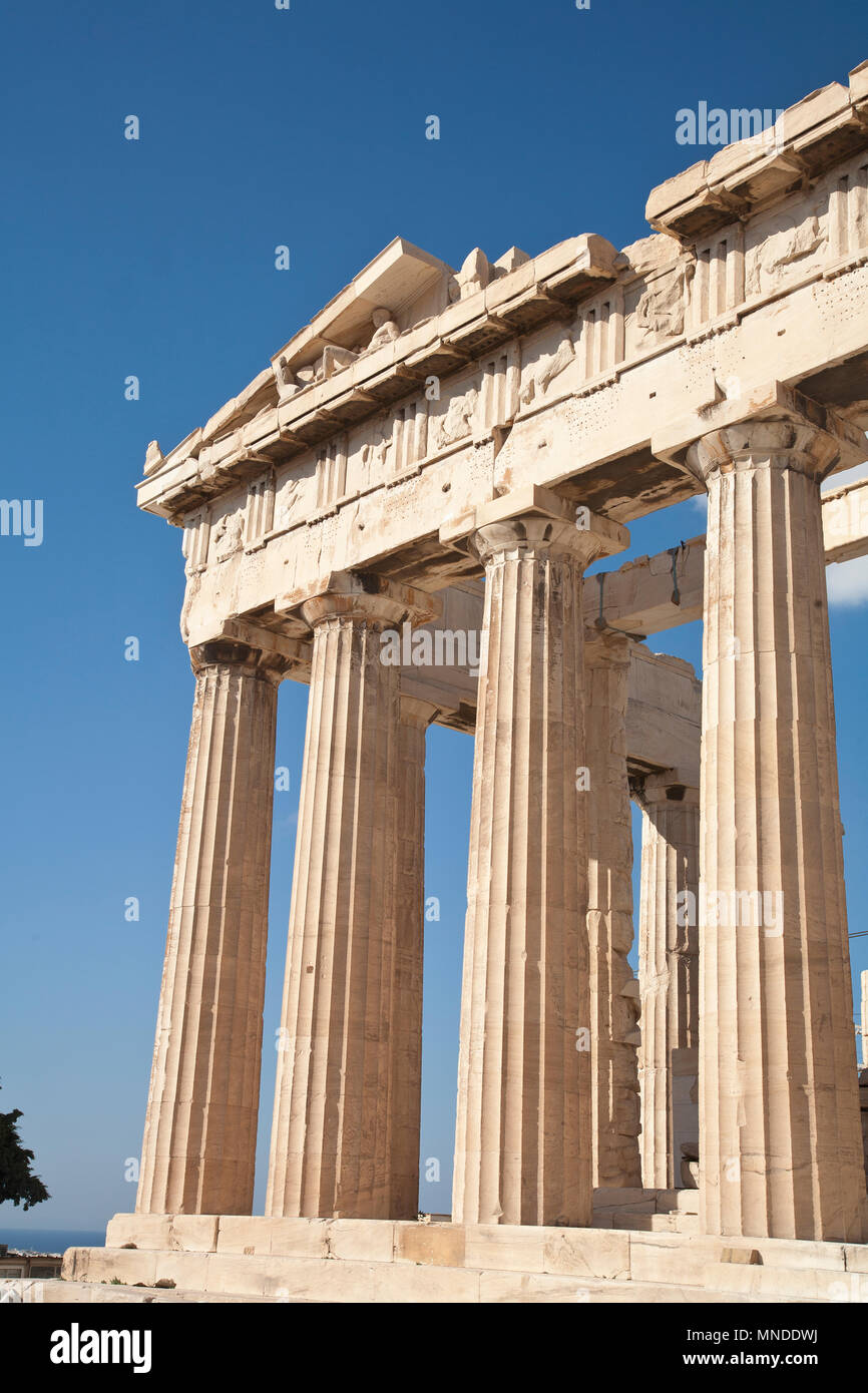 Vertical photo of tall marble pillars holding up remains of the greek ...