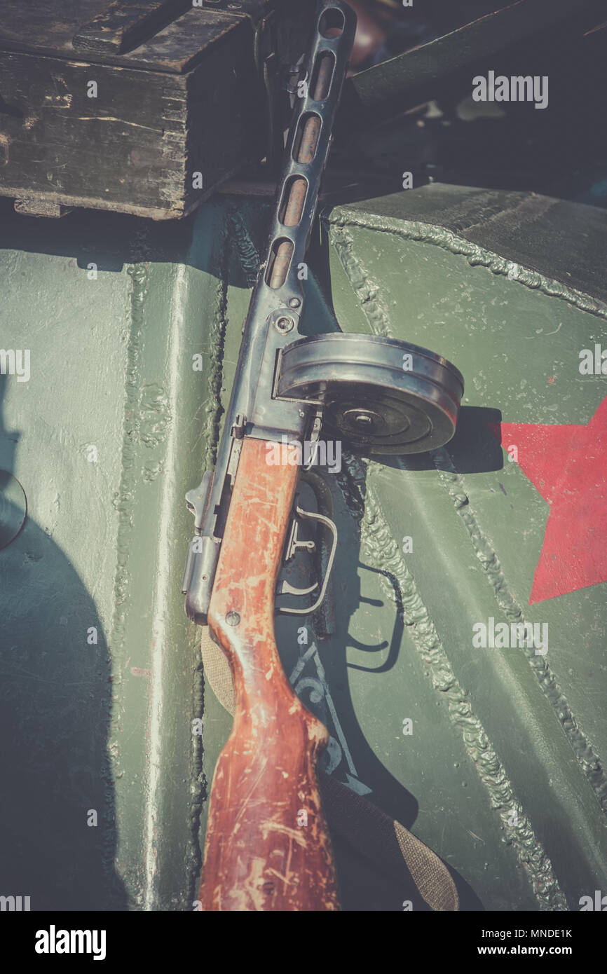 Submachine gun of Shpagin, PPSh been leaned against the armor of a tank ...