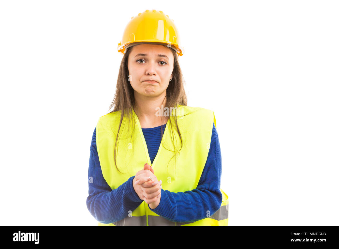 Young female engineer or architect begging by making please gesture as ...