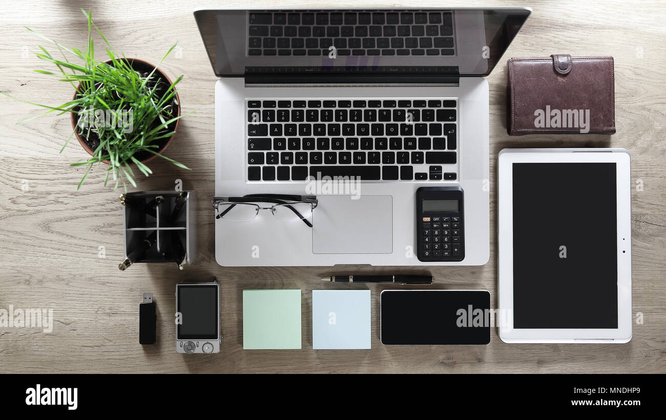 top view. office equipment, glasses and office supplies on a wooden ...