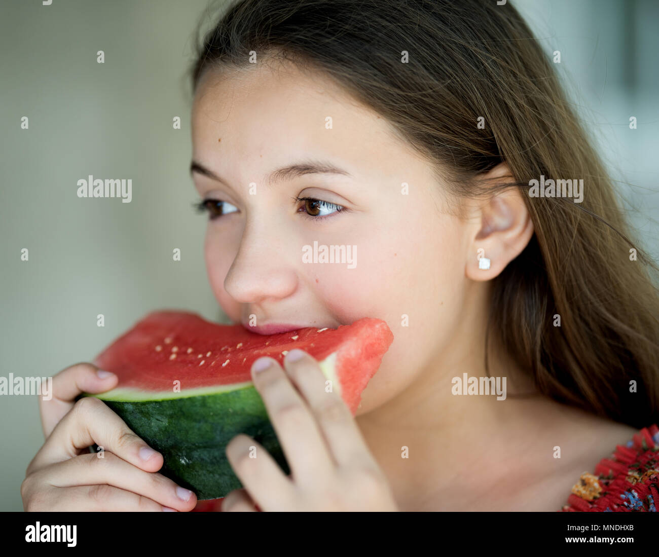 Young beautiful girl is eating watermelon. close-up Stock Photo - Alamy