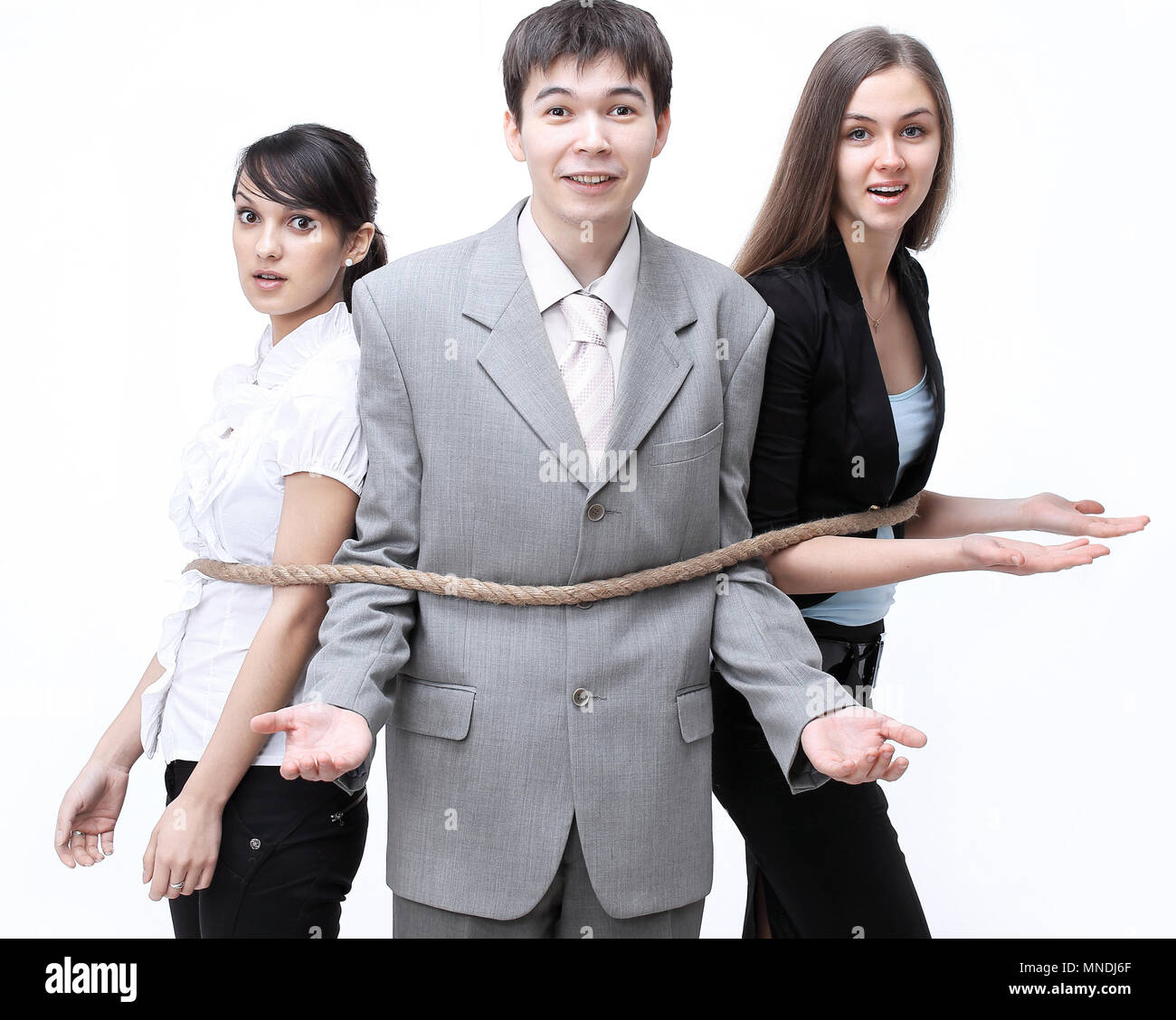 Young business people tied up together against Stock Photo - Alamy