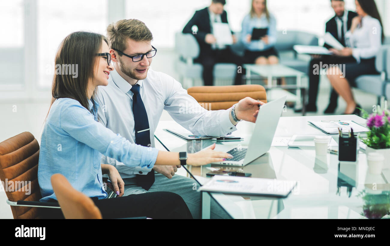 sales Manager and accountant are working on a laptop with financial ...